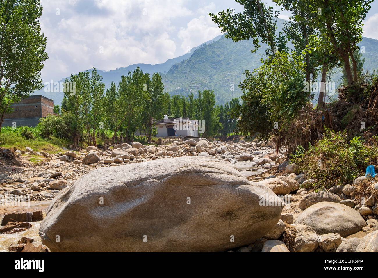 Swat River near Mingora, transformed by floods with increased depth and restored banks. A ...