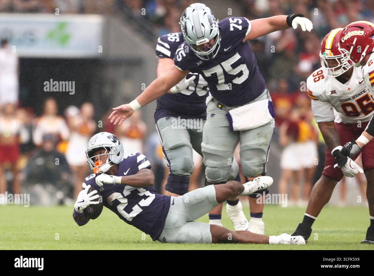 Kansas State DeVon Rice falls with the ball during an NCAA college ...