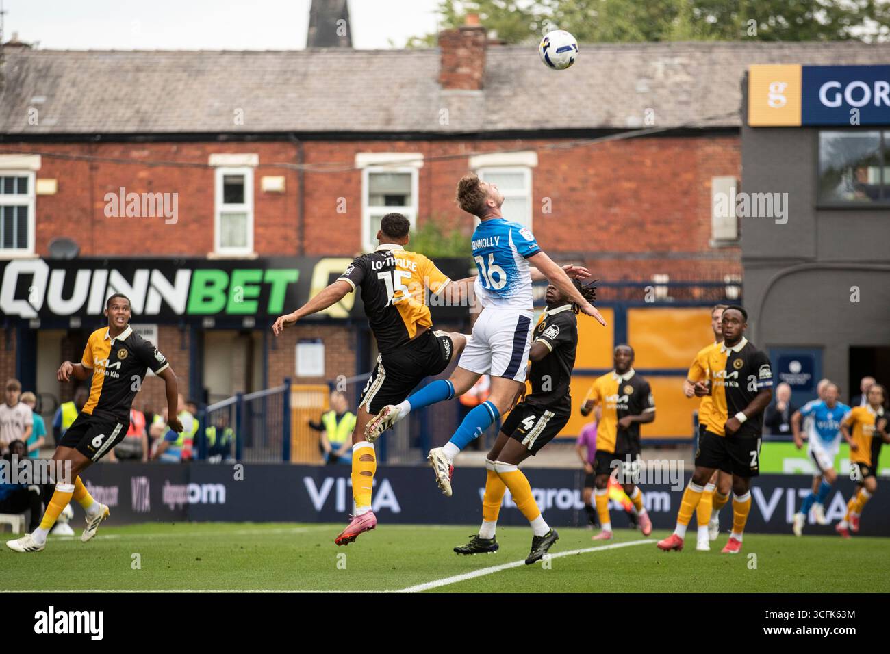 Callum Connolly #16 of Stockport County F.C. in aerial challenge with ...
