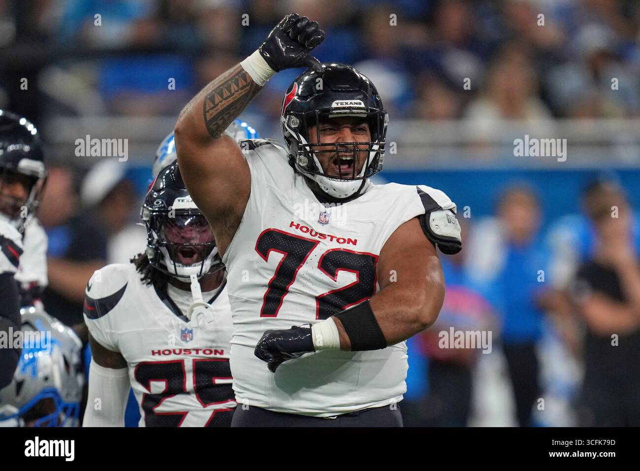 Houston Texans' Tommy Togiai (72) celebrates after sacking Detroit ...