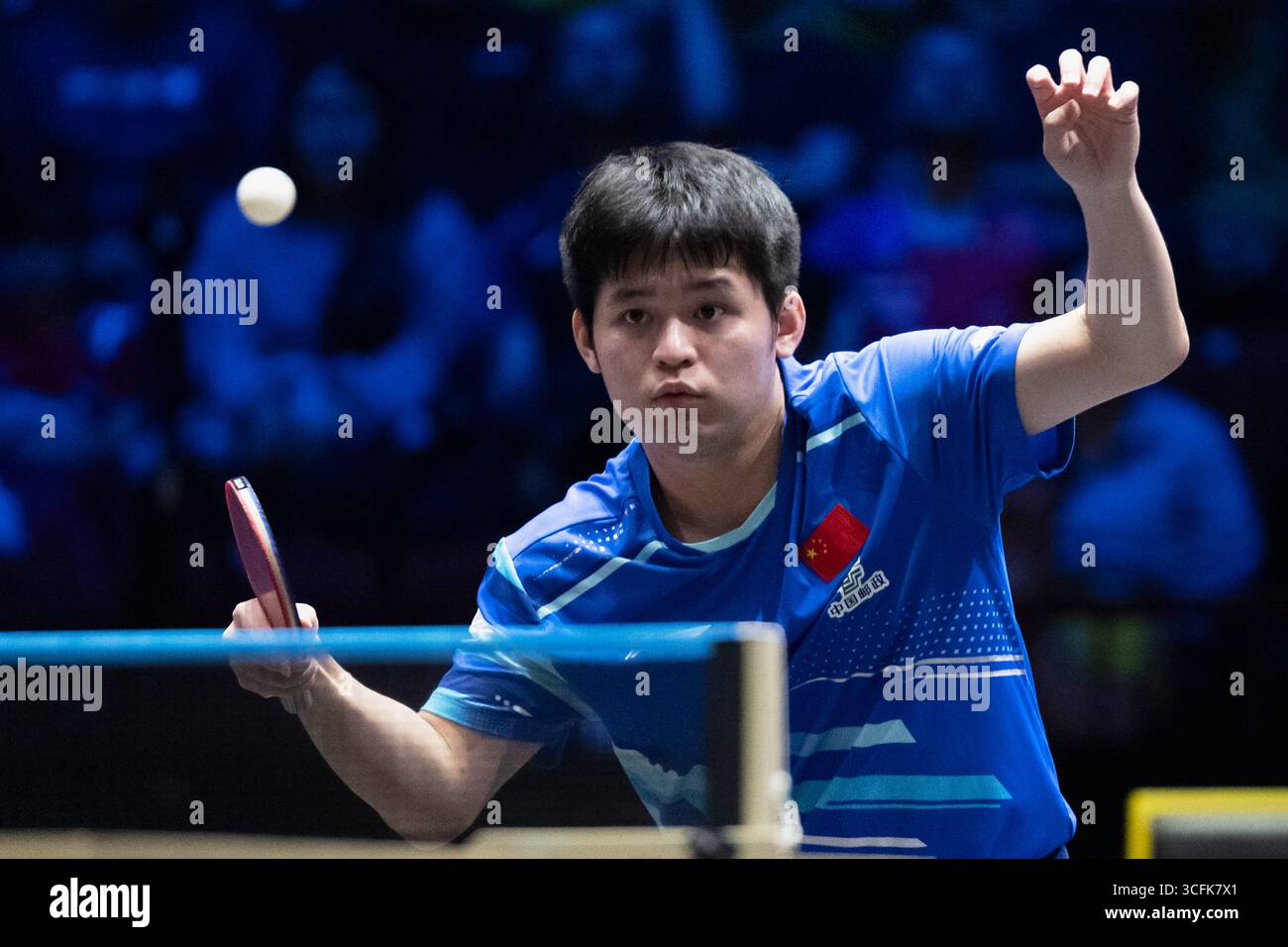 Lin Shidong from China in action against Simon Gauzy of France in the ...
