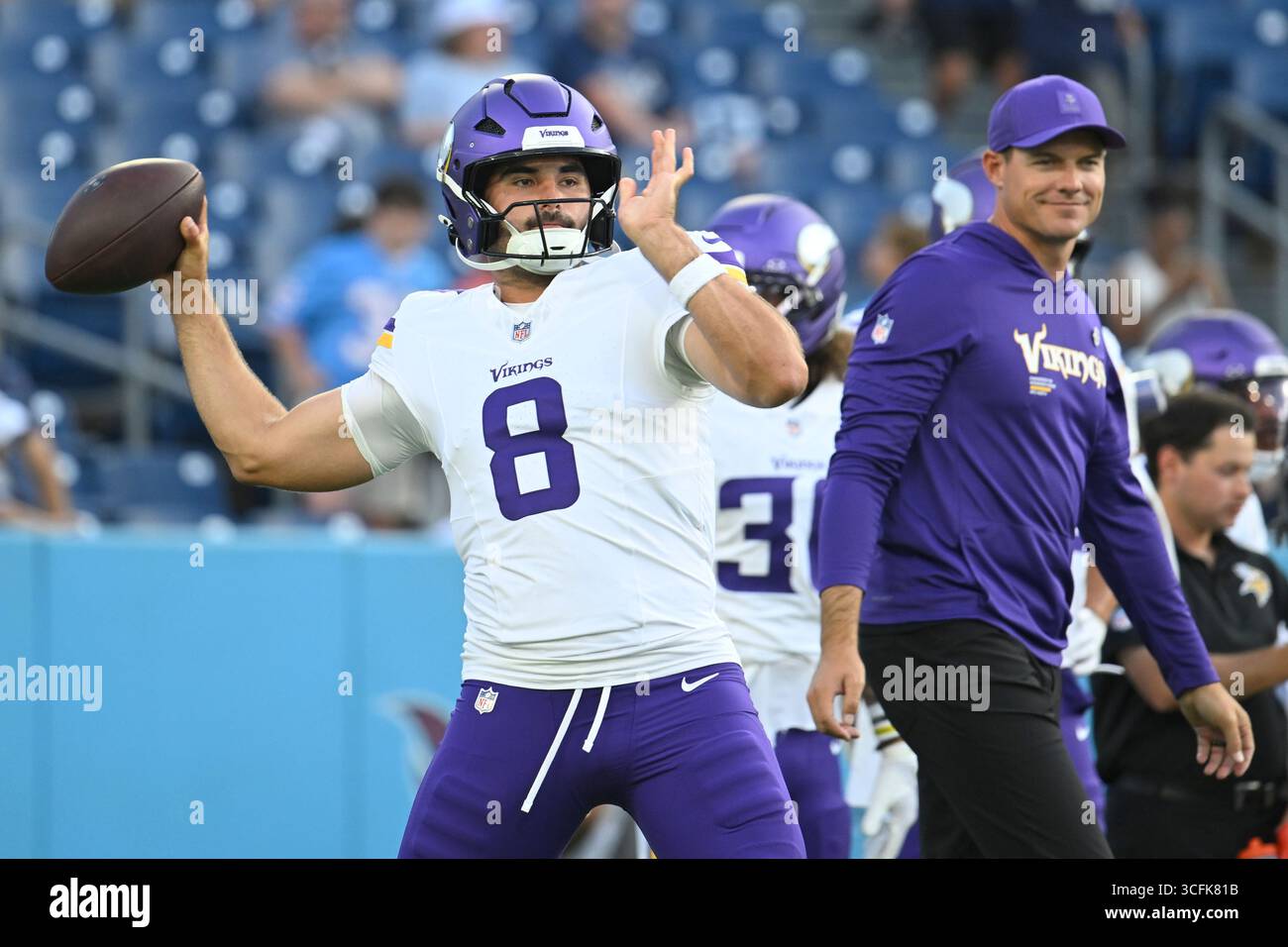 Minnesota Vikings quarterback Sam Howell (8) warms up as coach Kevin O ...