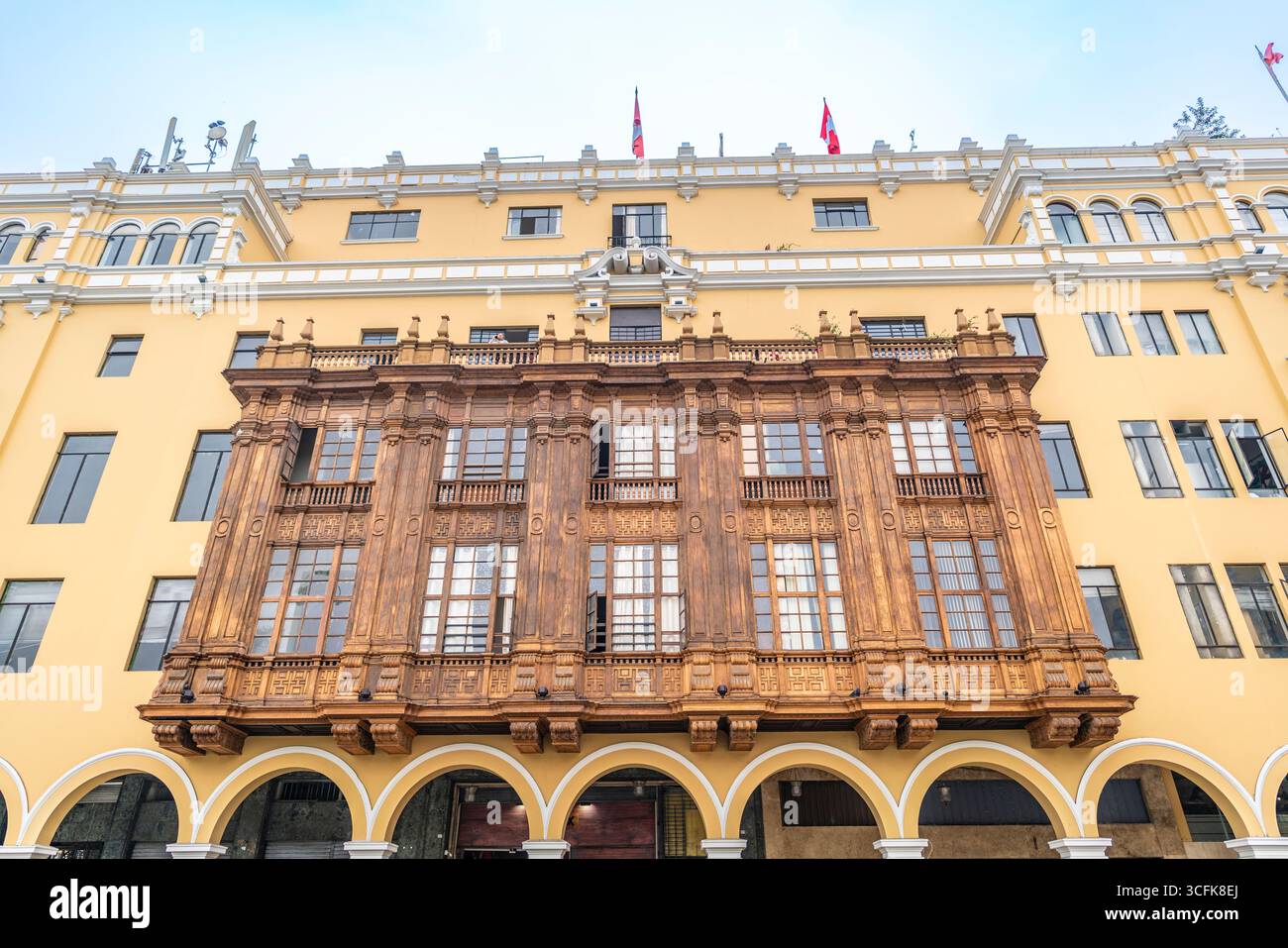 Colonial wooden balcony on historic yellow building at Plaza Mayor of ...