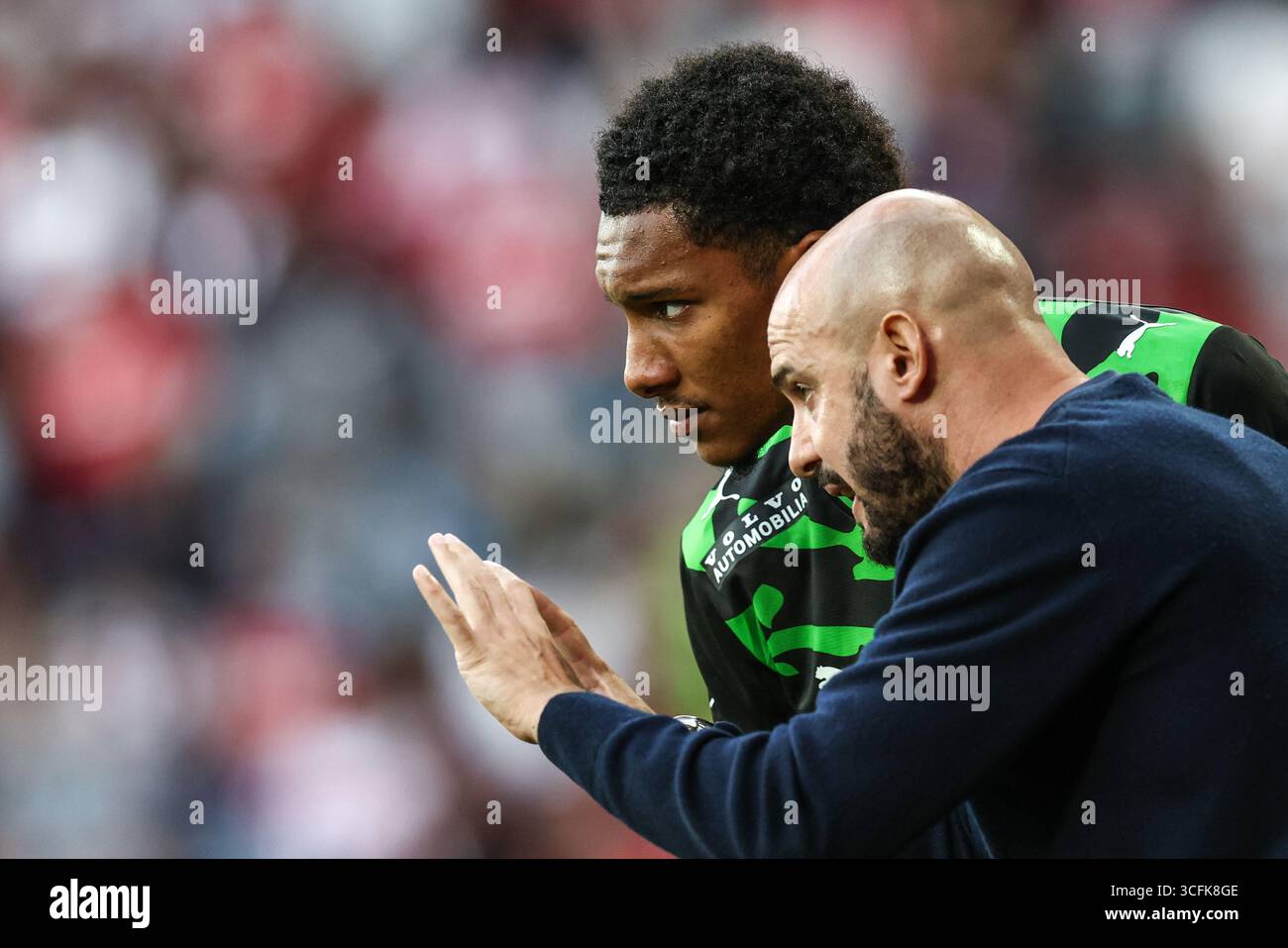 Cercle's Edan Diop and Cercle's head coach Onur Cinel pictured during a ...