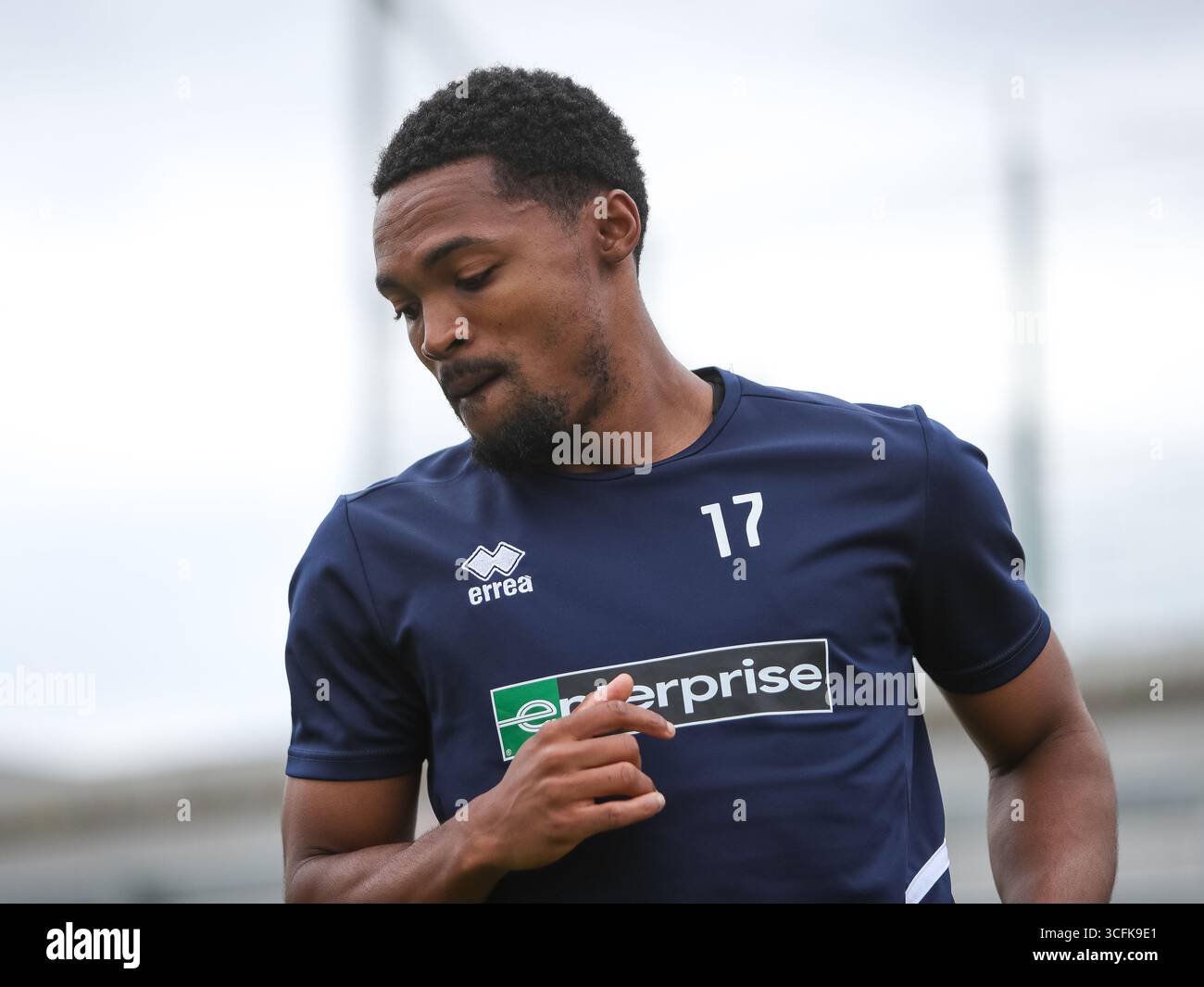 Brackley, UK. 23rd August 2025. Justin Donawa of Brackley Town warms up ...