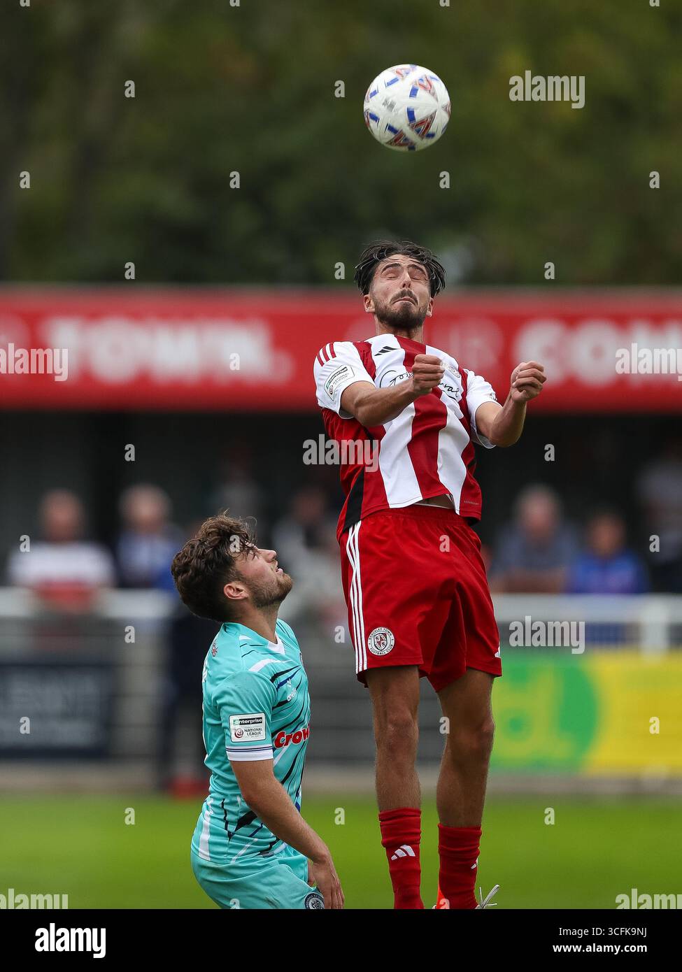 Brackley, UK. 23rd August 2025. Zak Brown of Brackley Town wins a ...