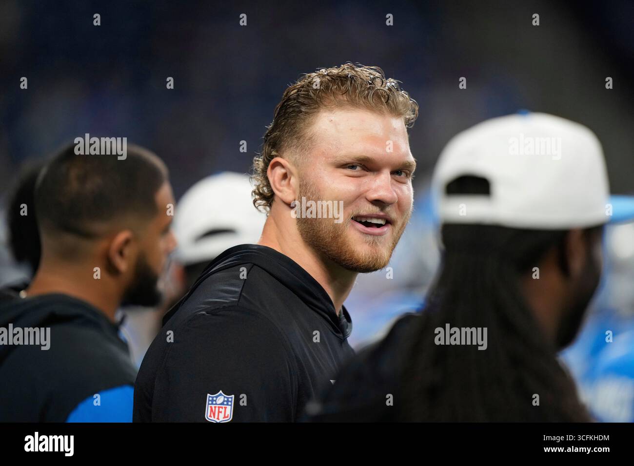 Detroit Lions defensive end Aidan Hutchinson watches players warm up before a preseason NFL ...