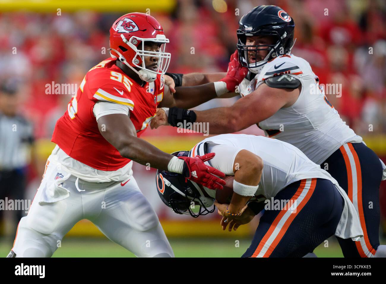 Kansas City Chiefs defensive tackle Chris Jones (95) fights off Chicago Bears center Drew Dalman ...