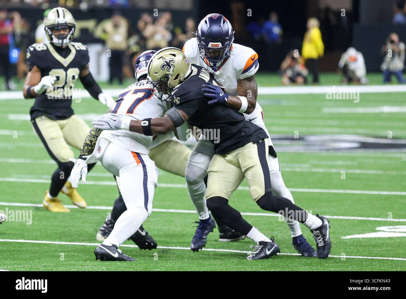 New Orleans Saints safety Ugo Amadi (0) tackles Denver Broncos running ...