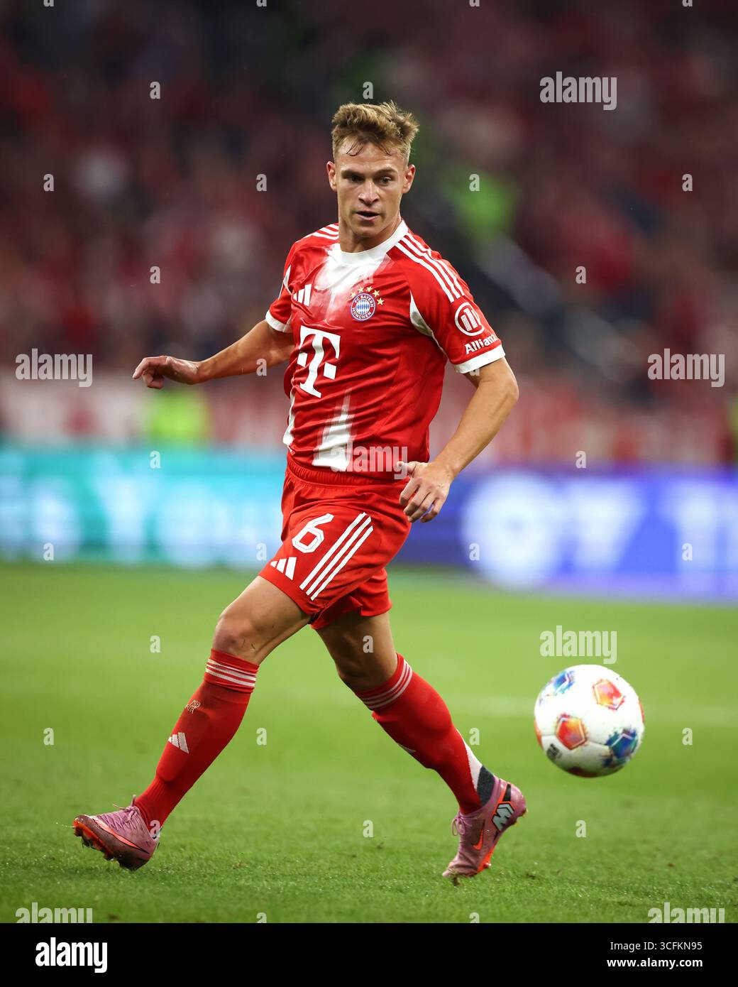 MUNICH, GERMANY - AUGUST 22: Joshua Kimmich of Bayern Muenchen runs ...
