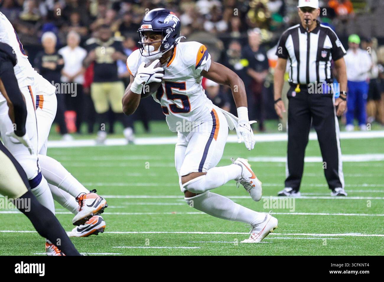 Denver Broncos running back Blake Watson (25) rush for some yardage ...