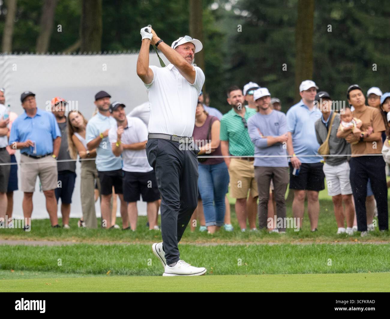PLYMOUTH, MI - AUGUST 23: Phil Mickelson chips the ball during round ...