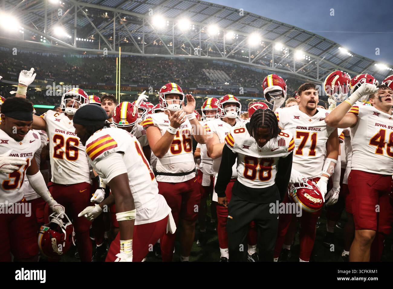 Iowa State players celebrate after winning an NCAA college football ...