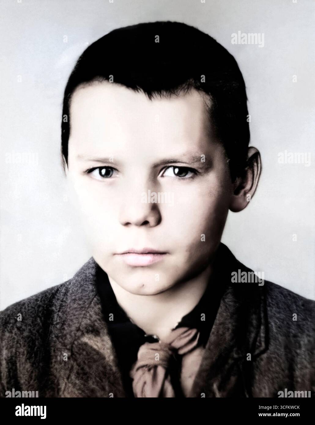 Retro portrait of a pioneer boy in a school uniform with a red tie ...