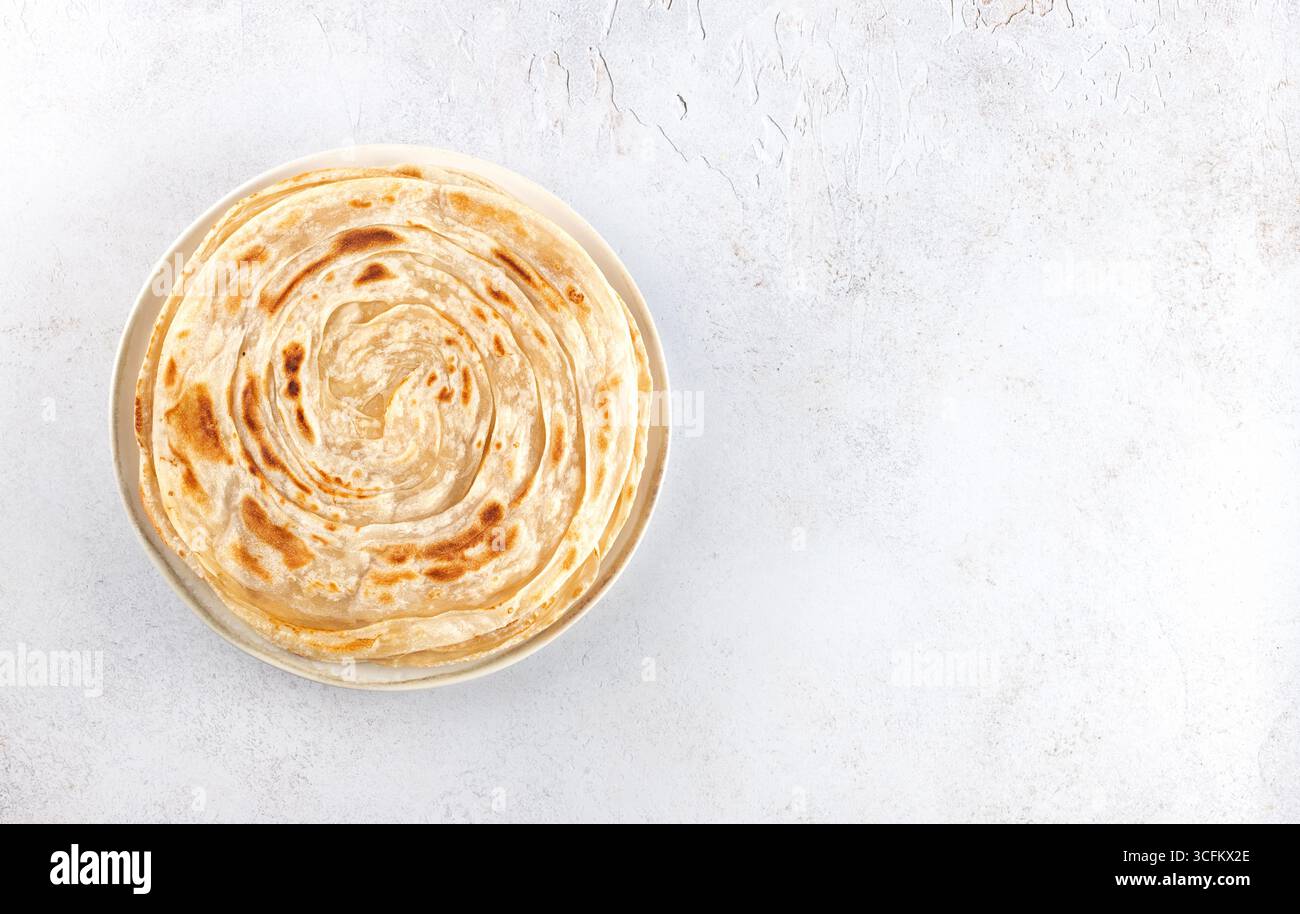 Traditional Indian paratha on white background. Indian food. Top view ...