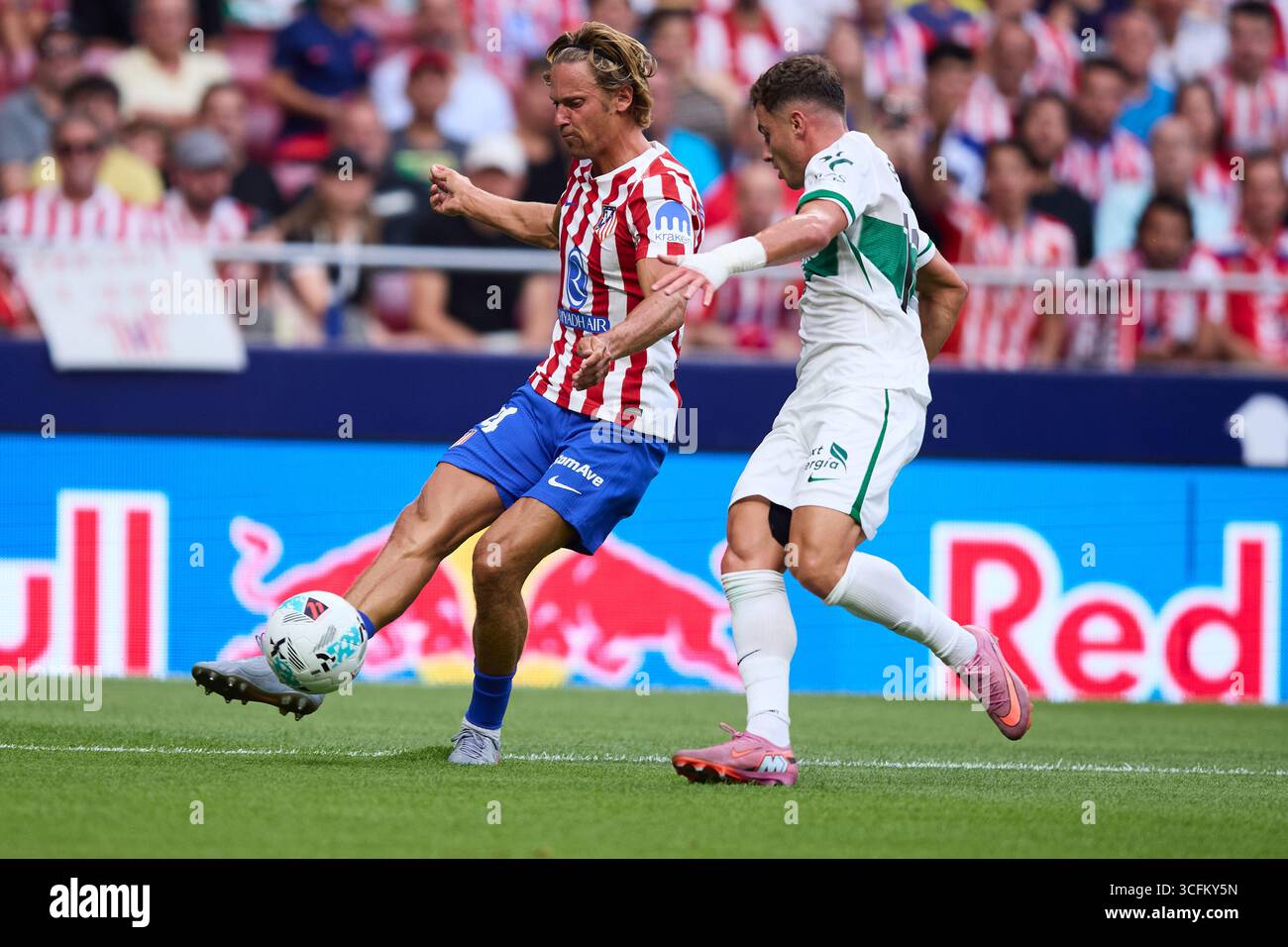 Marcos Llorente of Atletico de Madrid looks to pass the ball during the ...