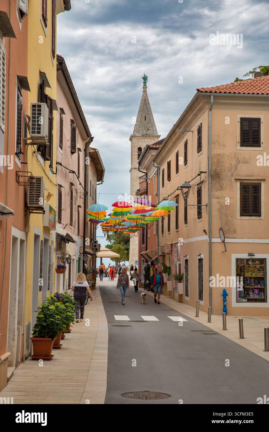 Novigrad, Croatia - May 22, 2025: Vibrant rainbow umbrellas suspended ...