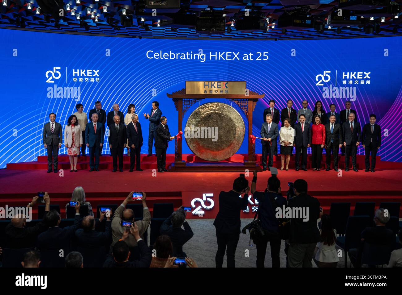 HKEX Marks 25th Anniversary A Gong striking event at an event to mark ...