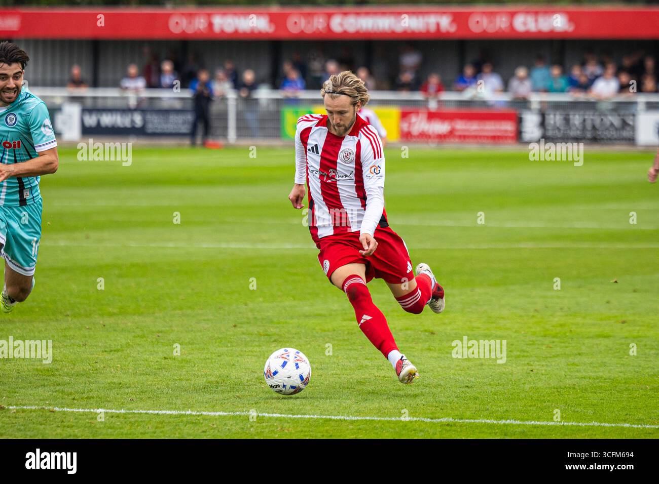 Morgan Roberts (10 Brackley Town) running with the ball during the ...