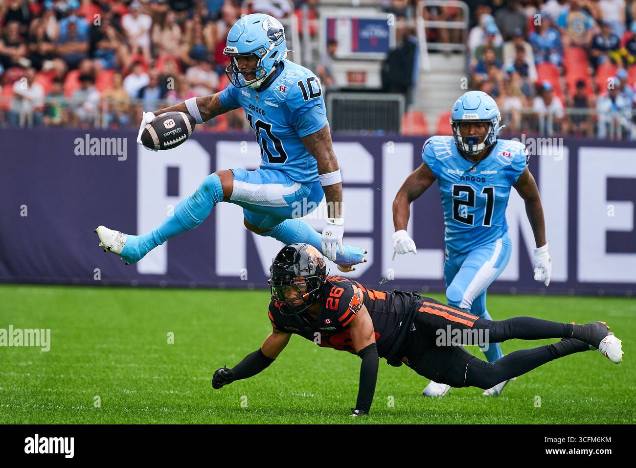Toronto Argonauts wide receiver Kevin Mital (10) evades a tackle from B ...