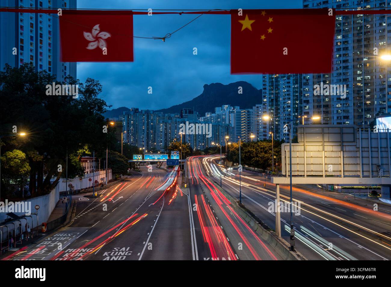 Hong Kong Daily Life A long exposure photo showing the national flag of ...