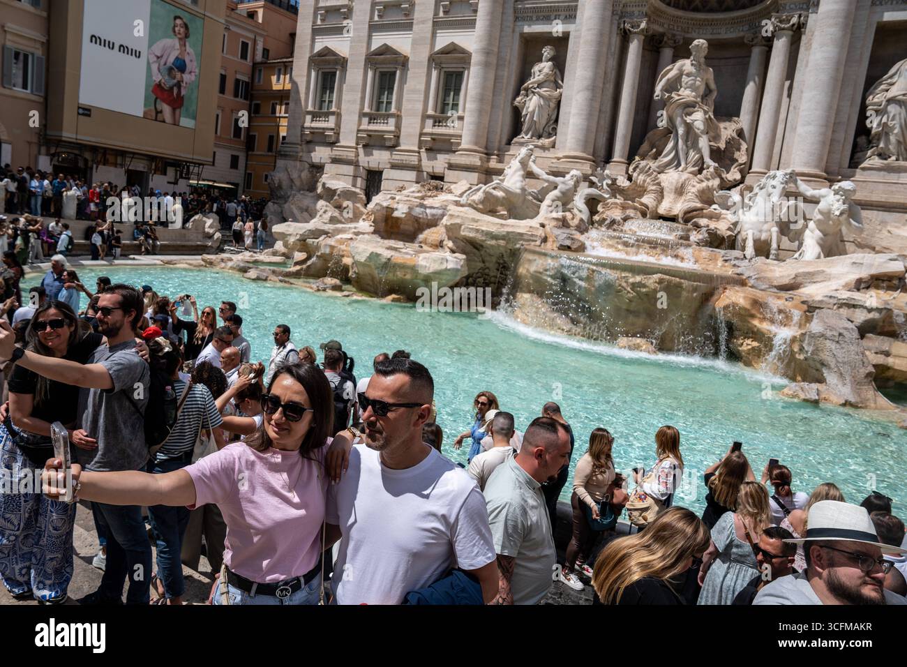 Daily Life in Rome People posing for a selfie at Trevi Fountain on May ...