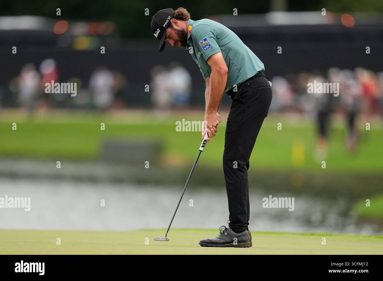 Cameron Young putts on the 15th green during the third round of the ...