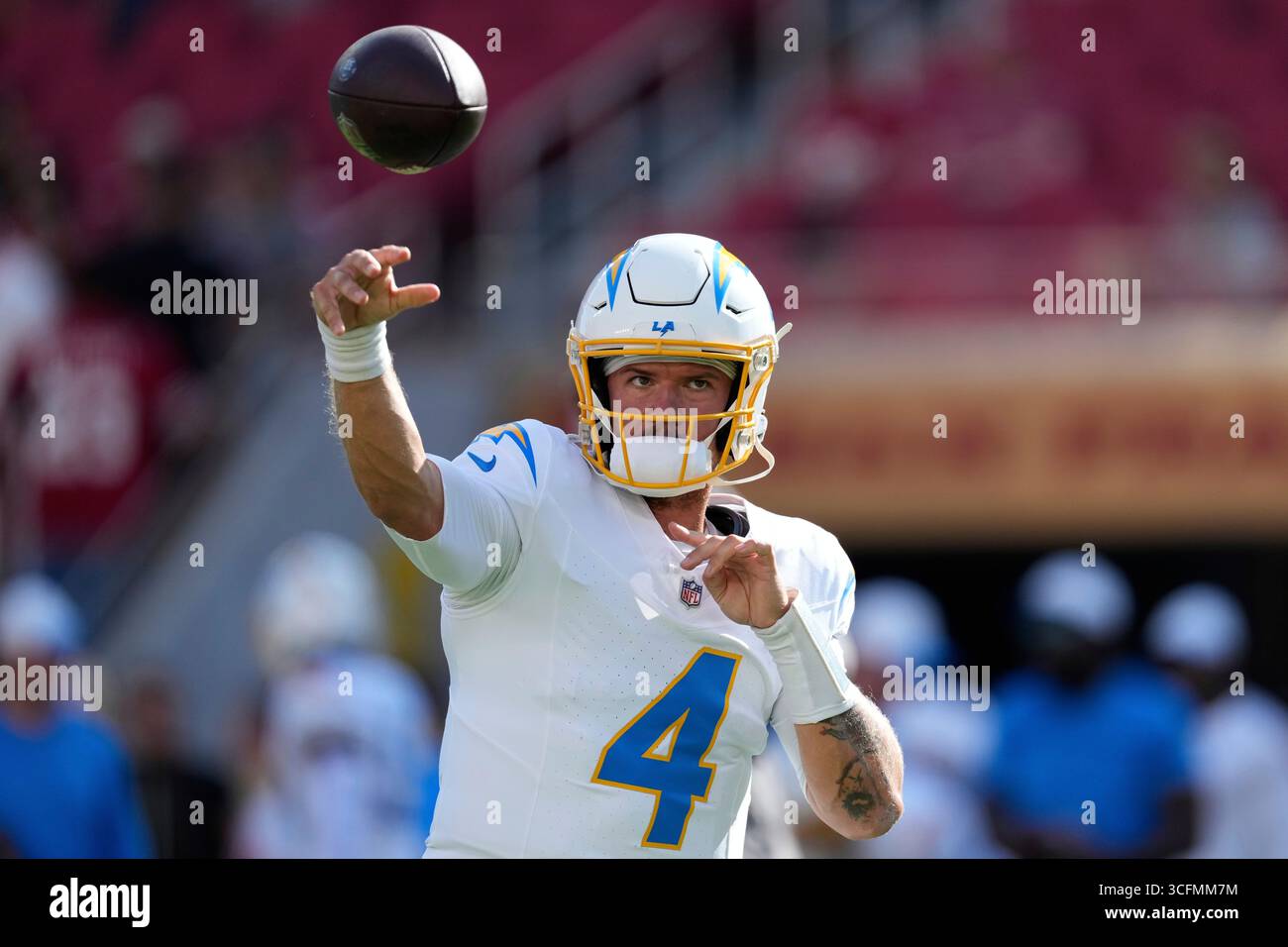 Los Angeles Chargers quarterback Taylor Heinicke (4) warms up before an ...