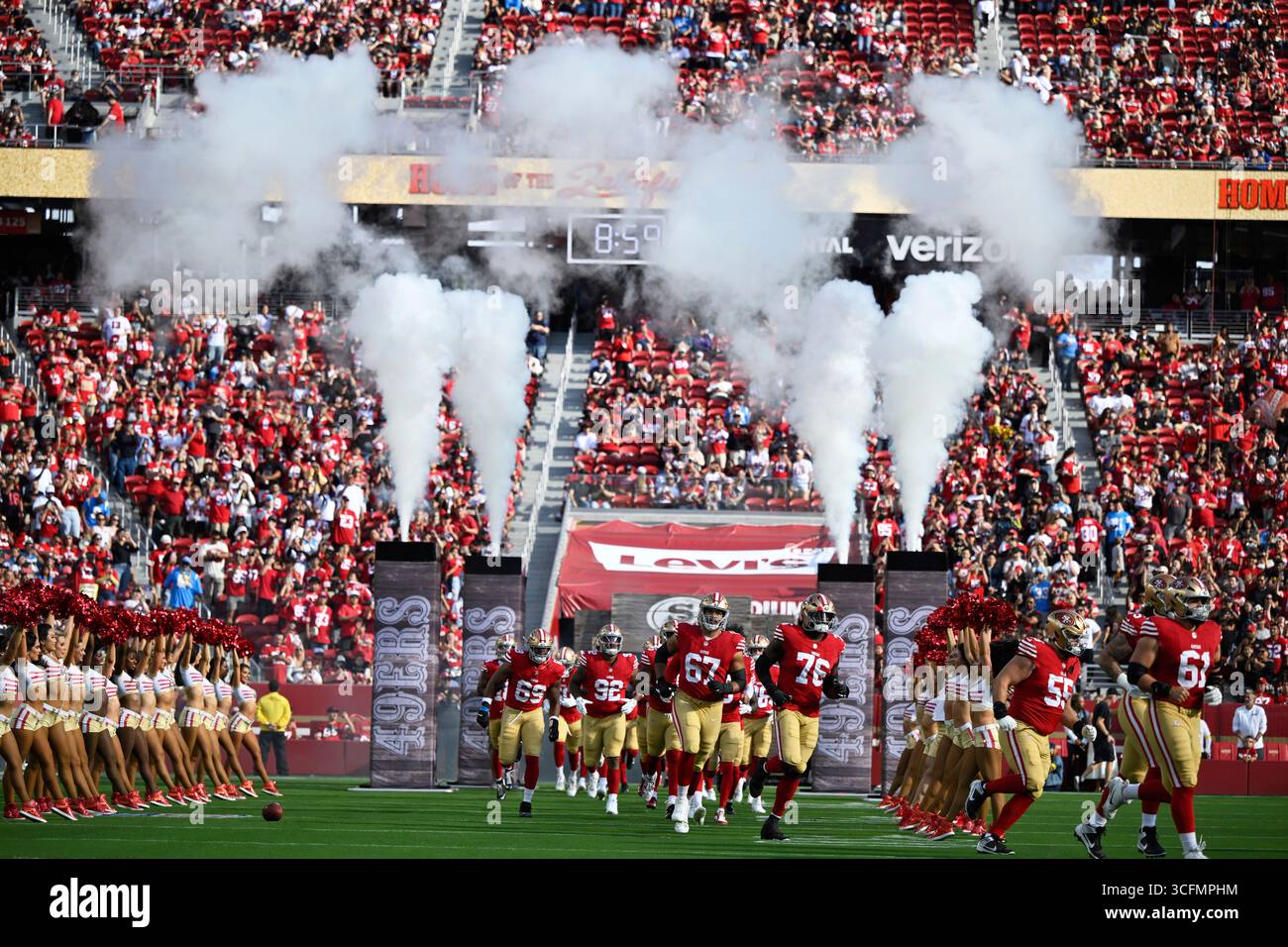 San Francisco 49ers players run onto the field before an NFL preseason ...