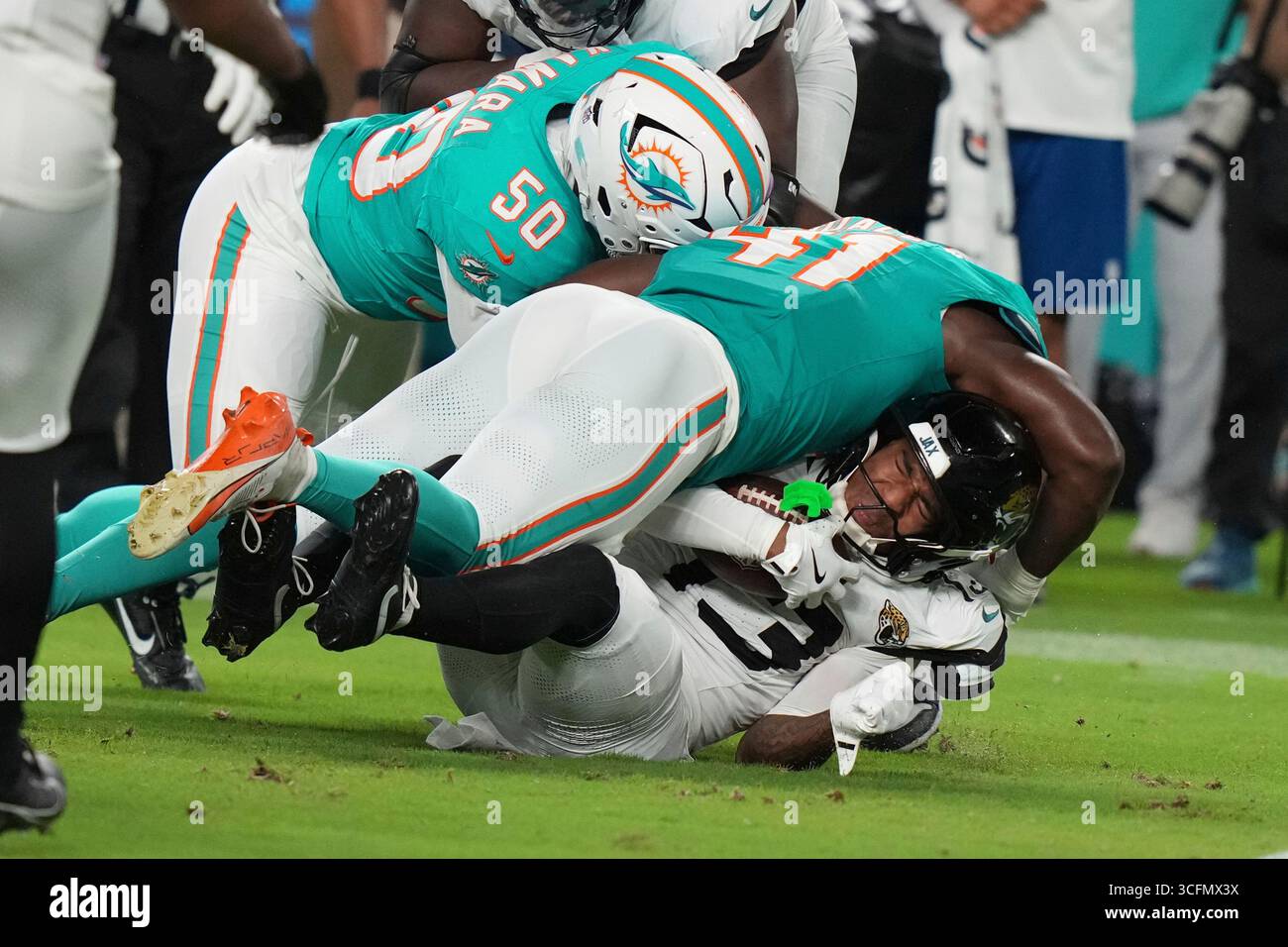 Jacksonville Jaguars wide receiver Dorian Singer (13) is tackled by ...