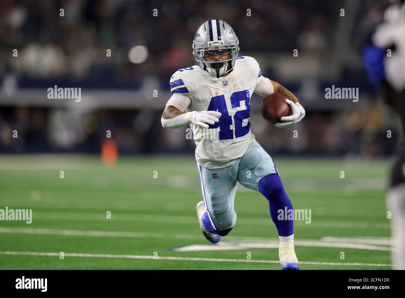 Dallas Cowboys running back Deuce Vaughn (42) rushes for a first down during a preseason NFL ...