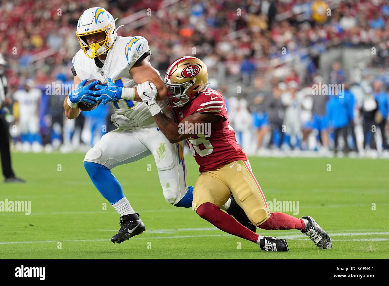 Los Angeles Chargers tight end Stevo Klotz, left, runs against San ...