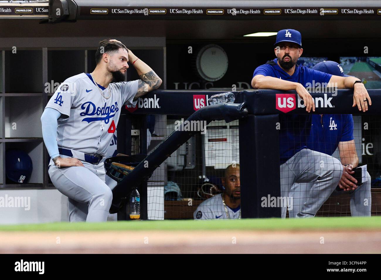 Los Angeles Dodgers' Andy Pages, left, looks on from the dugout during ...