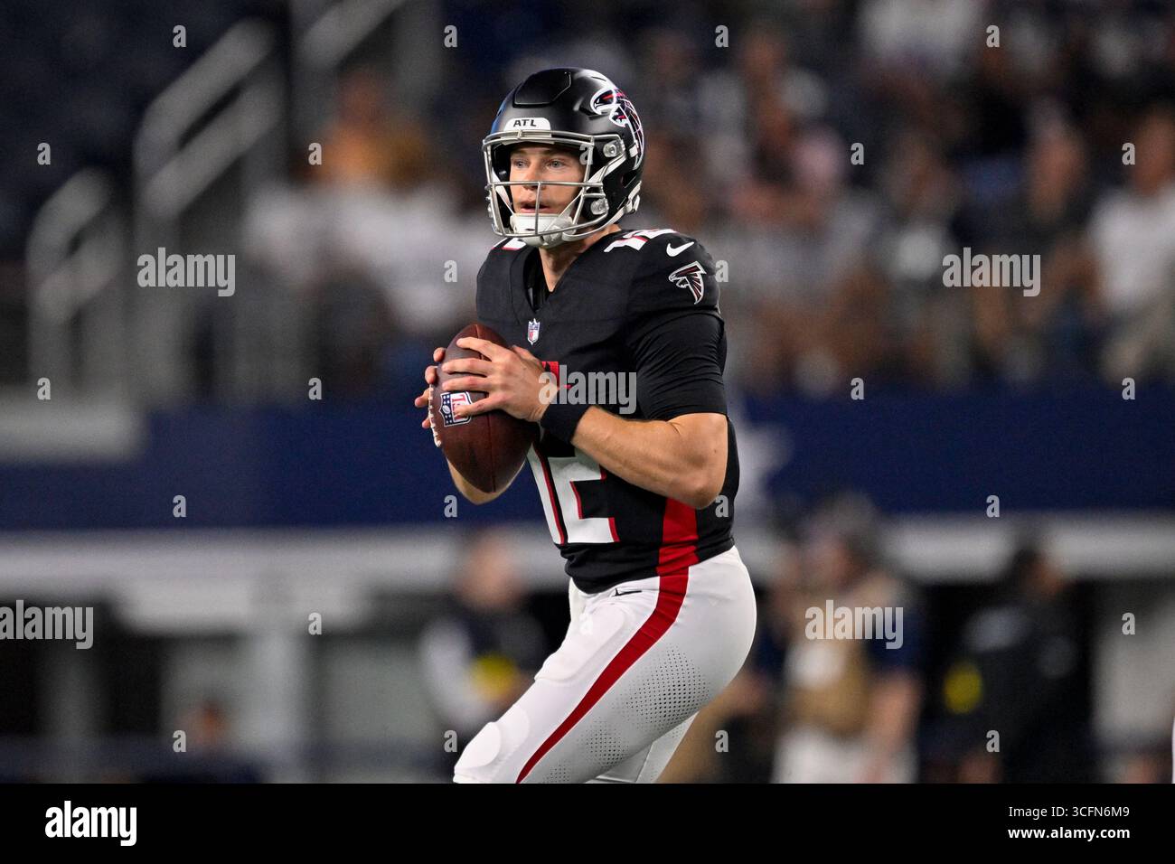 Atlanta Falcons quarterback Easton Stick (12) looks to throw the ball ...