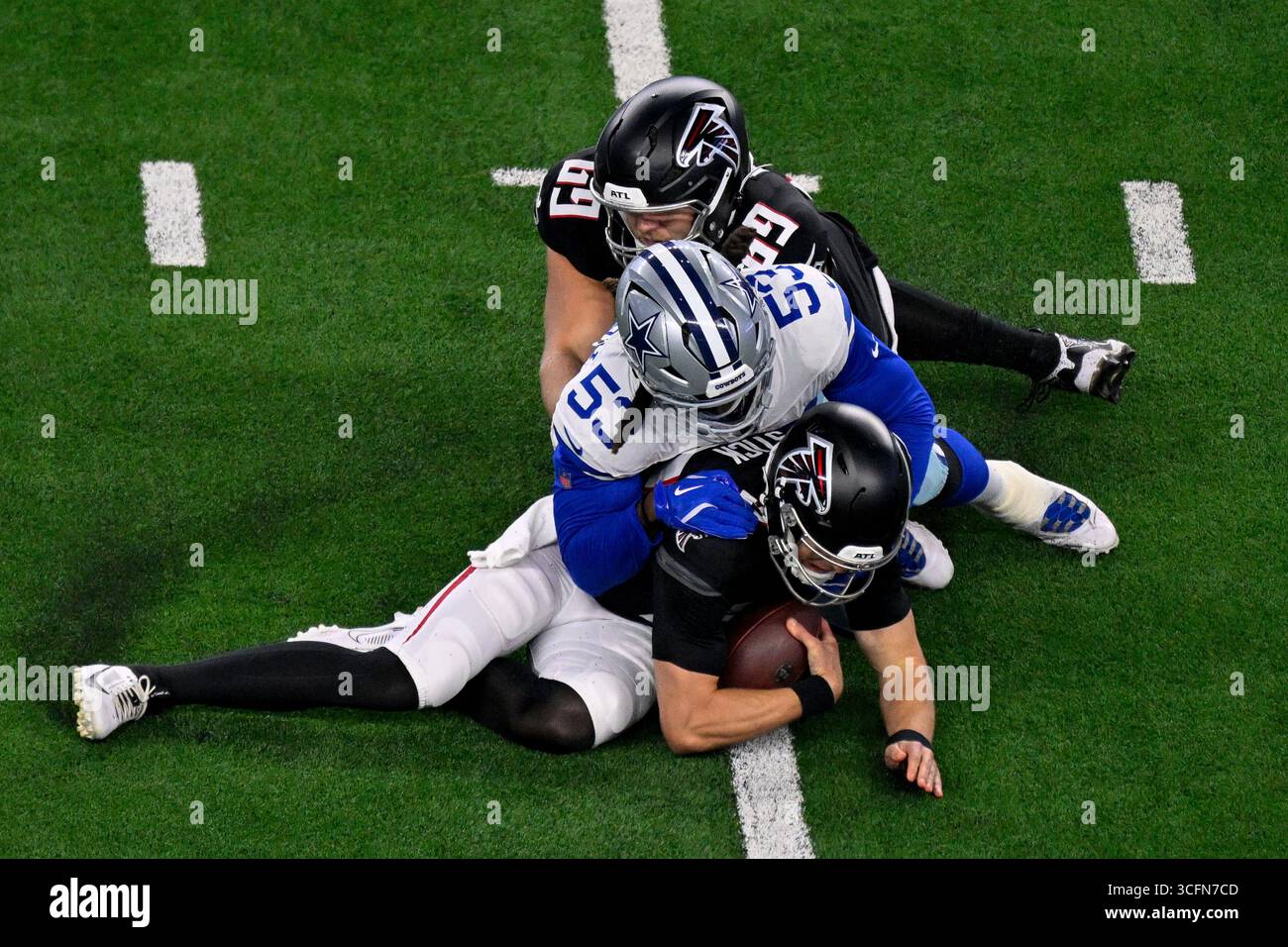 Atlanta Falcons quarterback Easton Stick (12) is sacked by Dallas ...