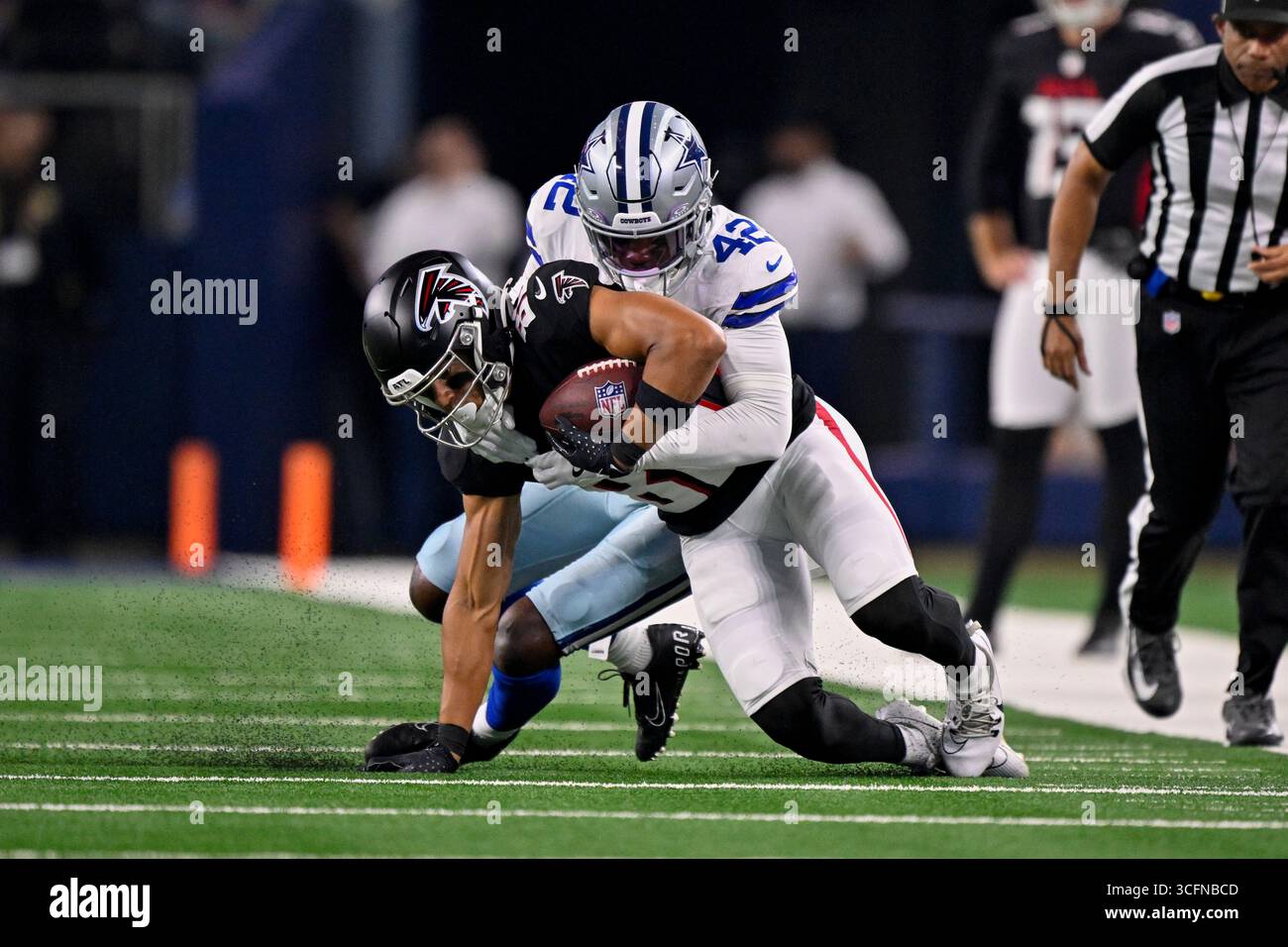 Dallas Cowboys cornerback Michael Ojemudia (42) tackles Atlanta Falcons ...