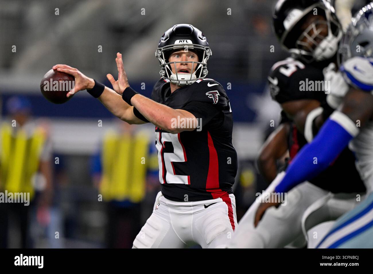 Atlanta Falcons quarterback Easton Stick (12) throws the ball during a ...