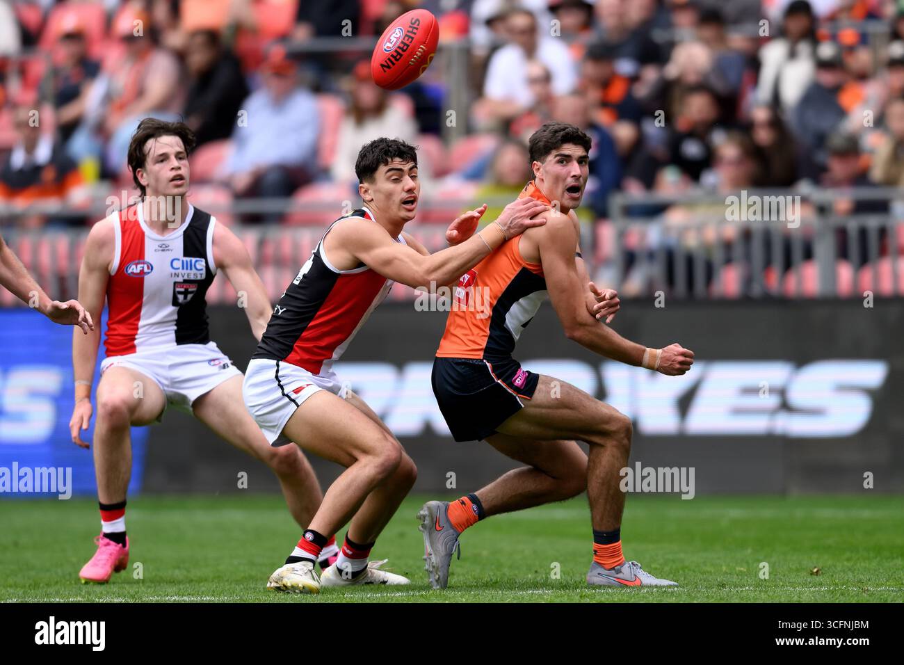Joe Fonti of the GWS Giants passes the ball during the NRL Round 25 ...