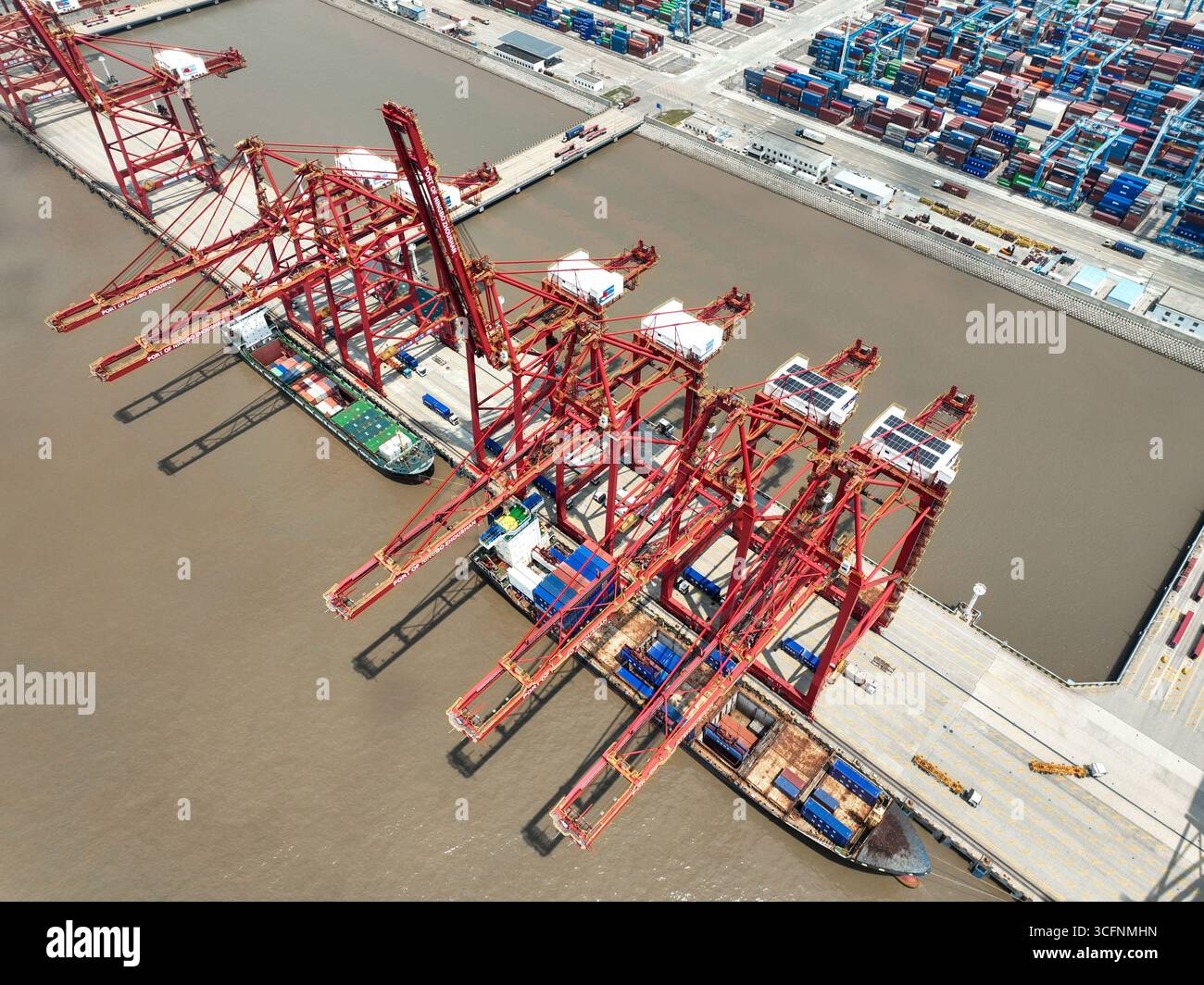 ZHOUSHAN, CHINA - AUGUST 24, 2025 - Cargo ships are loading and ...