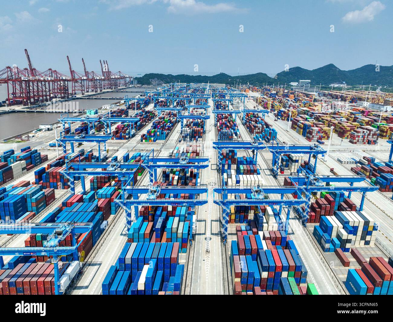 ZHOUSHAN, CHINA - AUGUST 24, 2025 - Unmanned trucks are transplanting ...