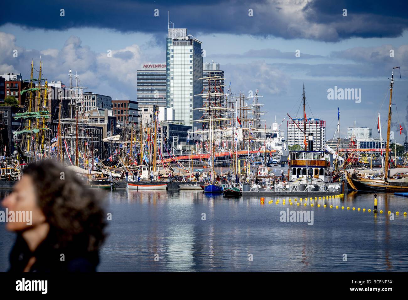 AMSTERDAM - Visitors and ships during Sail in Amsterdam. The tenth ...
