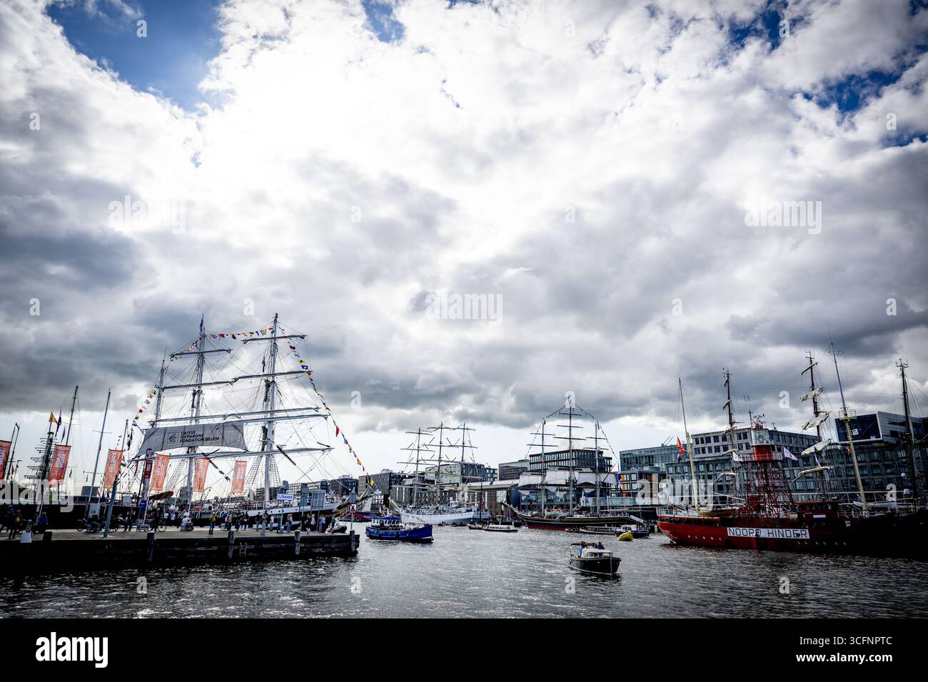 AMSTERDAM - Visitors and ships during Sail in Amsterdam. The tenth ...
