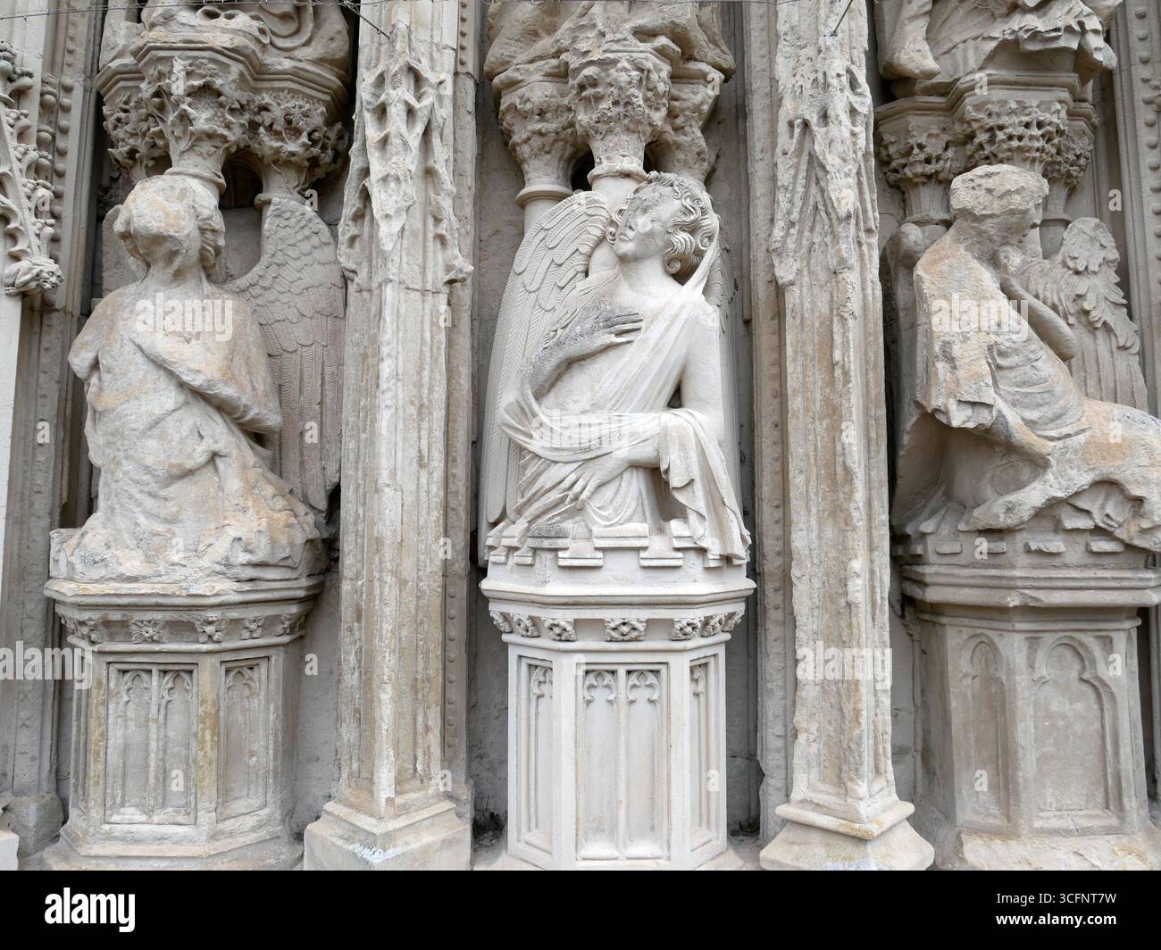 Medieval carved stone angel statues and Gothic architectural details ...