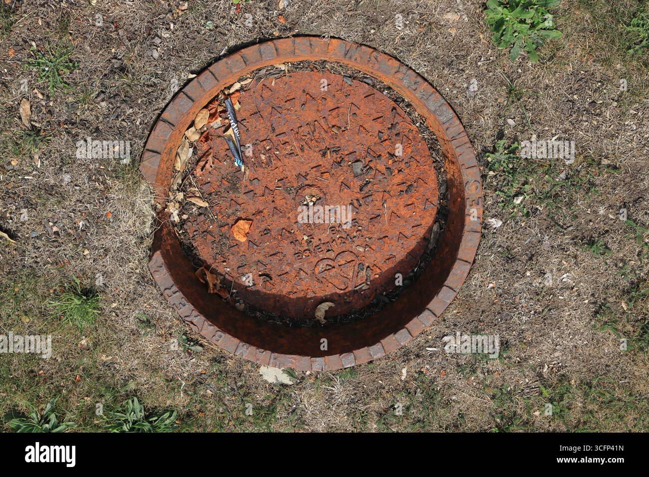 This rust-colored manhole cover at the Haslar Hospital site is set into ...