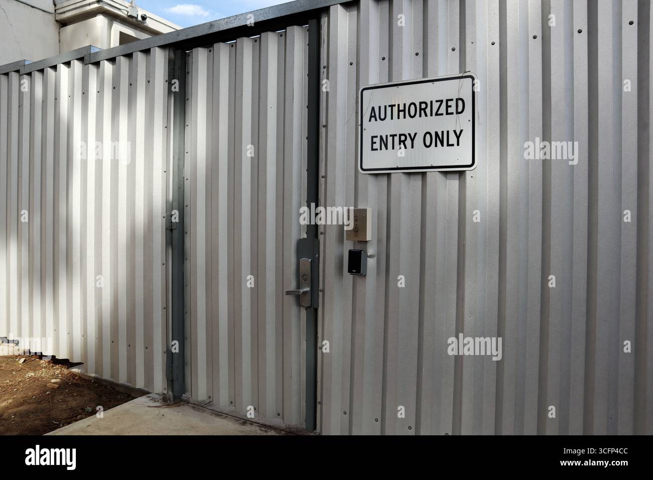 Gate with sign "Authorized Entry Only Stock Photo - Alamy