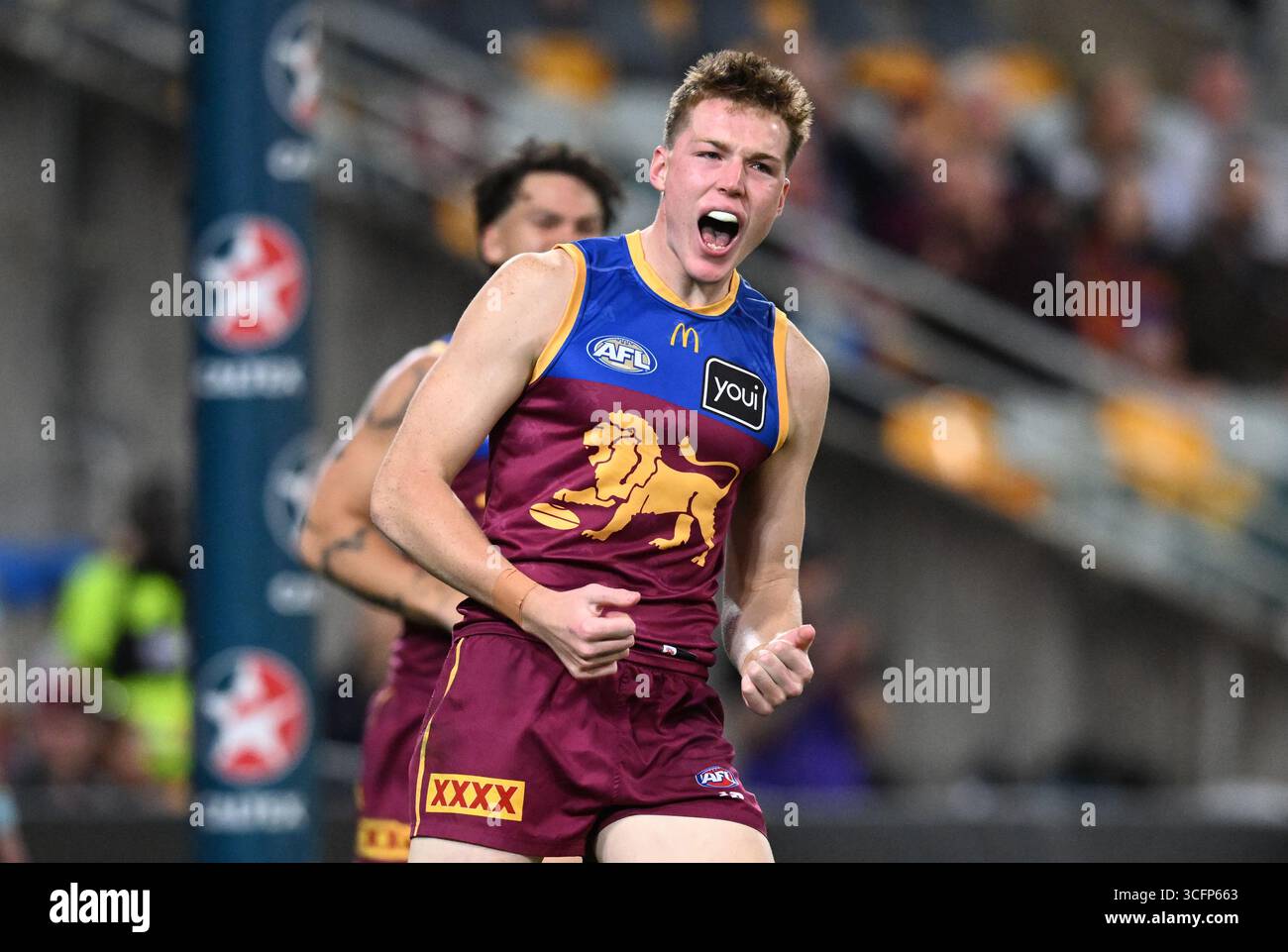 Logan Morris of the Lions celebrates kicking a goal during the AFL ...
