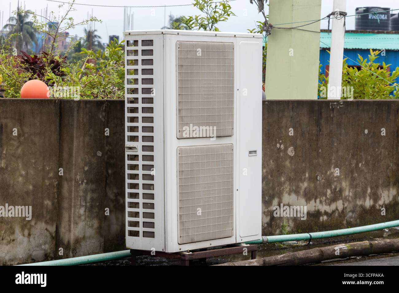 Double condensing units on a rooftop building, part of a commercial air ...
