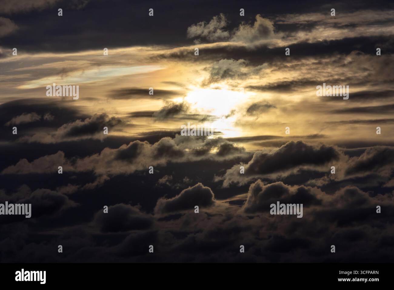 A bold and vibrant sunset with a fiery, glowing sun sinking below the ...