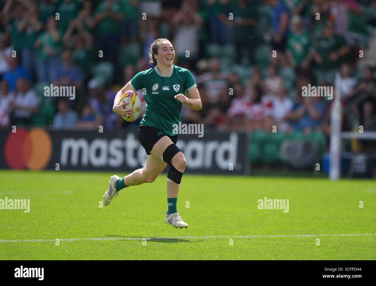 Ireland's Eve Higgins runs in to score her sides fifth try during the ...