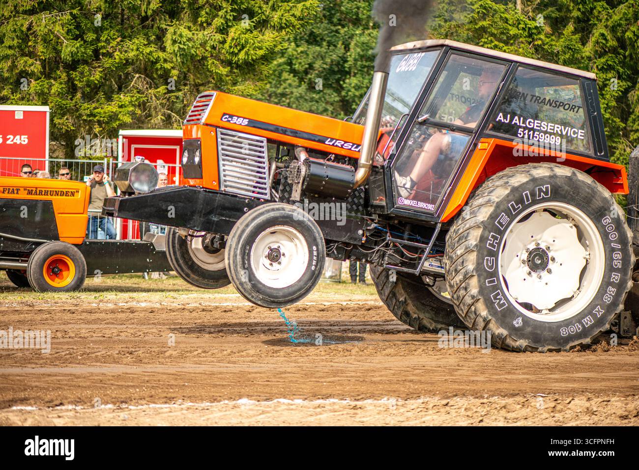 Aarhus, Denmark . August 16 2025: “Fullpull” tractor pulling ...